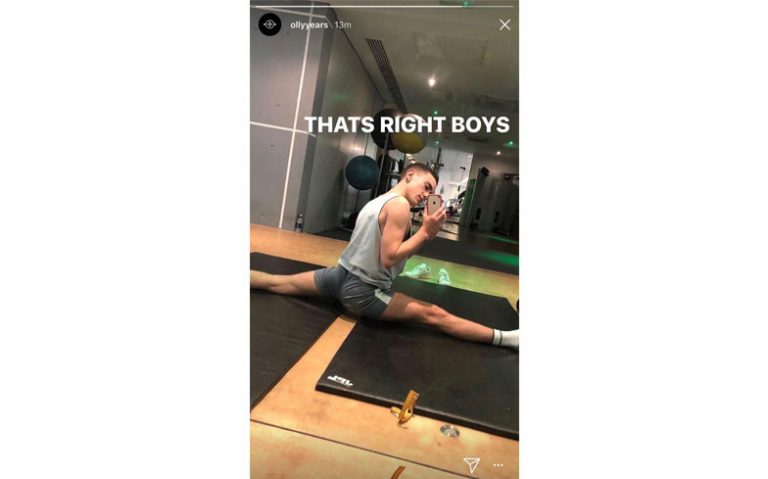 Olly Alexander shows off how bendy he is by doing the full splits