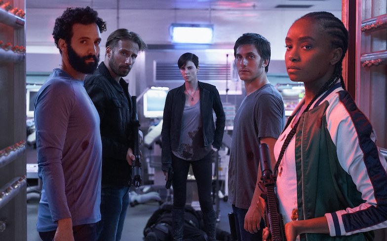 This scene from The Old Guard is one of the most passionate queer movie ...